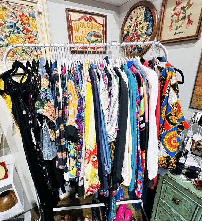 A rainbow of vintage clothing where every piece has lived a life before yours. That silk blouse has stories to tell.