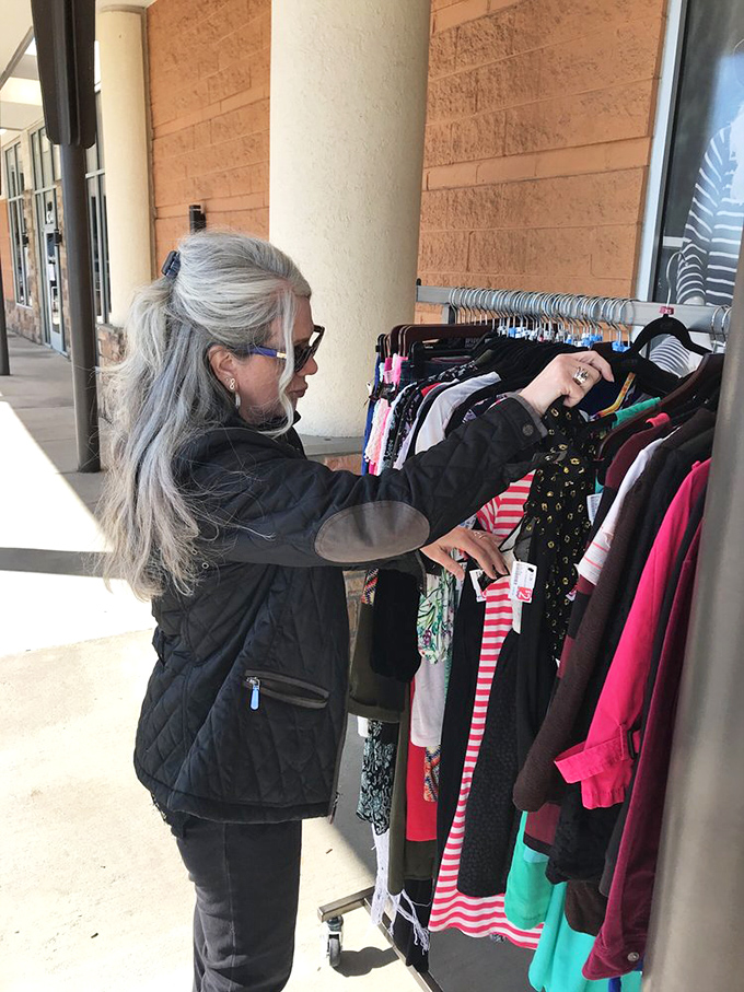 The thrill of the hunt in action. This shopper knows that patience and a keen eye are the secret weapons of secondhand success.