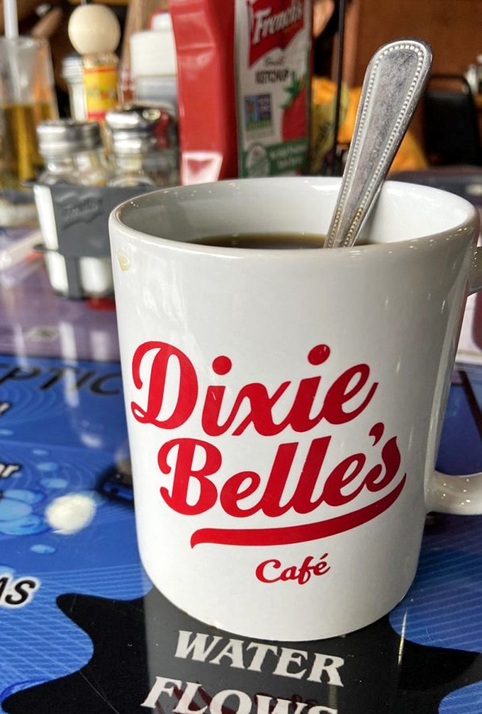 The coffee mug says Dixie Belle's, but what it really means is "bottomless liquid motivation" that keeps coming until you surrender.