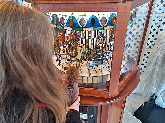 Peering into this miniature mechanical marvel is like watching dreams through a keyhole—a stained glass carousel world in perpetual, mesmerizing motion.