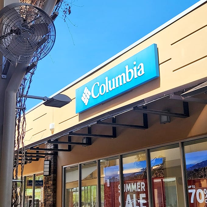 Columbia's storefront promises adventure gear at prices that won't require a second mortgage, with summer sales that are almost as hot as Arizona itself.
