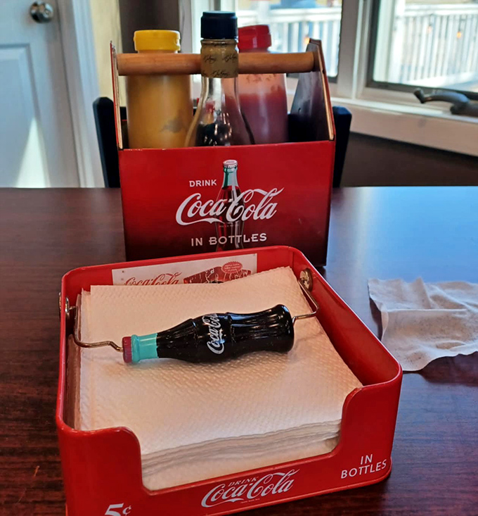 The condiment caddy&mdash;where hot dog dreams are customized to perfection. That Coca-Cola carrier isn't just vintage; it's a time machine to simpler pleasures.