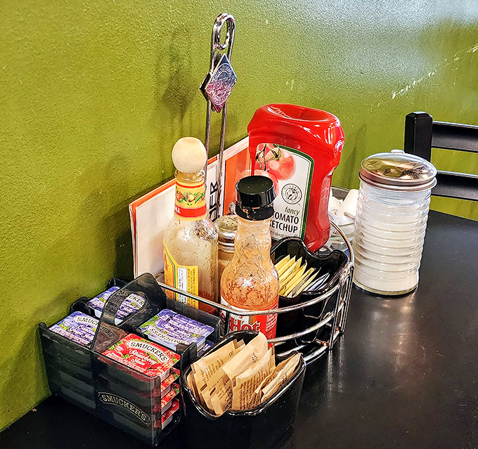 The condiment caddy&mdash;an unsung hero of breakfast establishments&mdash;stands ready to elevate your meal with hot sauce diplomacy.
