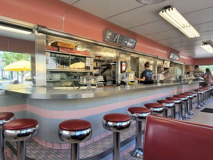 Chrome stools lined up like soldiers ready for the breakfast rush. Each one has probably heard more town gossip than the local barber.