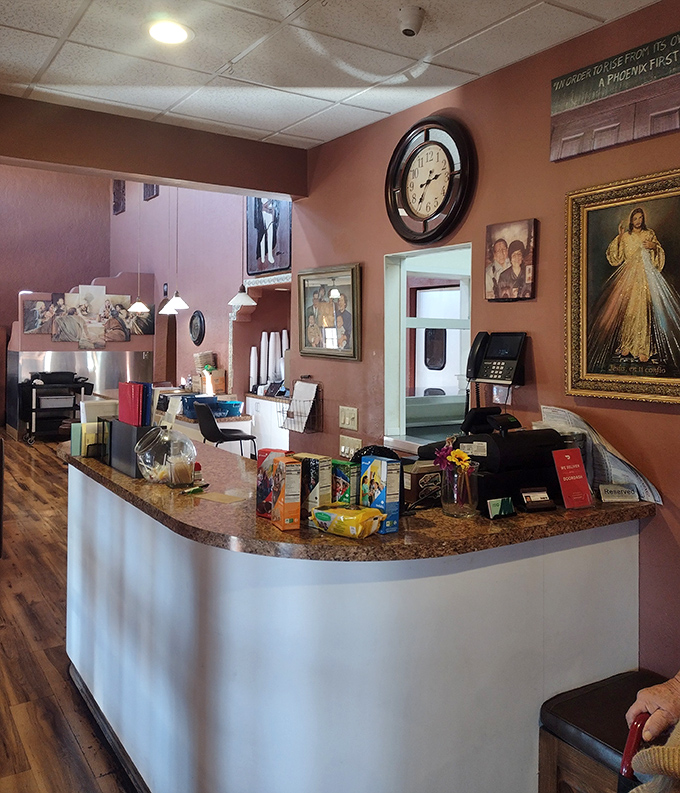 The heart of operations where orders become dreams and dreams become plates. Those religious icons aren't just decor&mdash;they're watching over the sacred recipes.