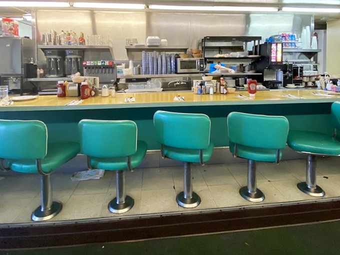 Those mint-green counter stools have witnessed more morning conversations and coffee refills than any therapist's couch in Palm Desert.