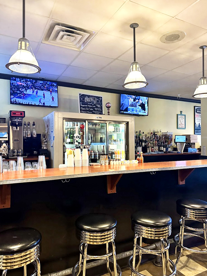 The bar area: where mimosas are born and breakfast dreams come true. Those classic diner stools have witnessed countless "I needed this" first sips.