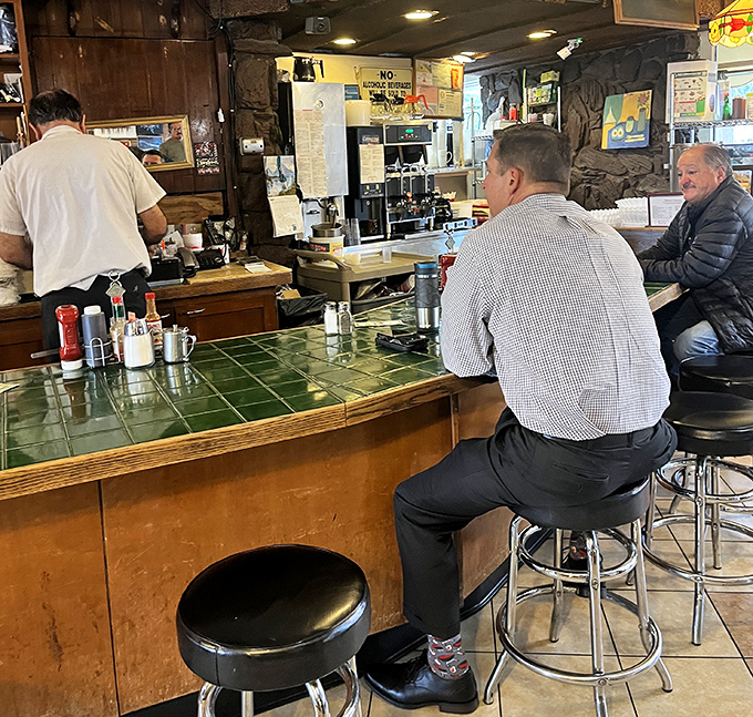 Counter seating with a front-row view of the griddle ballet happening behind the scenes.