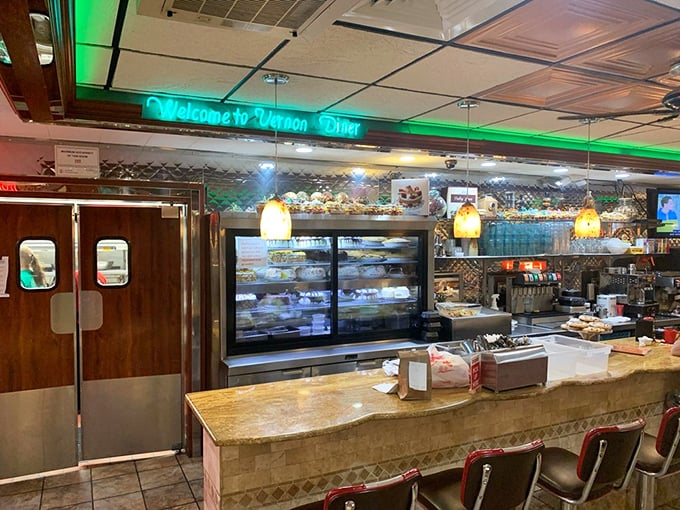 The counter area welcomes you with a neon "Welcome" sign&mdash;because even the lighting fixtures understand proper Connecticut hospitality.
