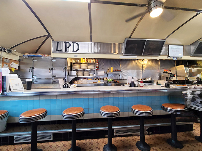 The heart of any great diner is its counter, where strangers become friends and the kitchen ballet unfolds before your very eyes.