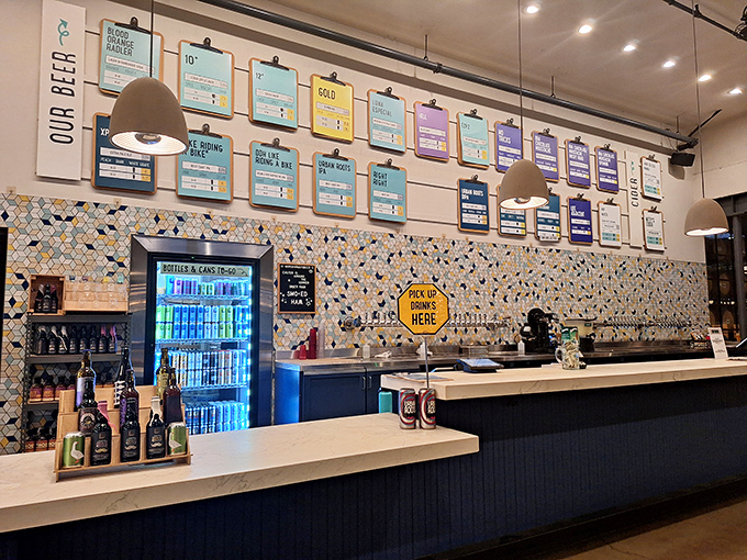 The beer menu wall transforms brewing into art, with colorful clipboards announcing what's pouring today in this hoppy gallery.