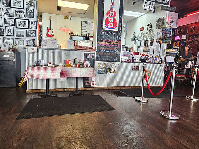 The ordering counter: where dreams are placed and fulfilled. Those red-checkered tablecloths signal you're in a place that takes food seriously, not itself.