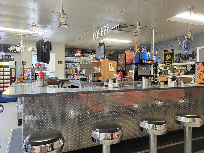 The counter where magic happens &ndash; classic diner stools inviting you to sit, stay awhile, and watch breakfast choreography in action.