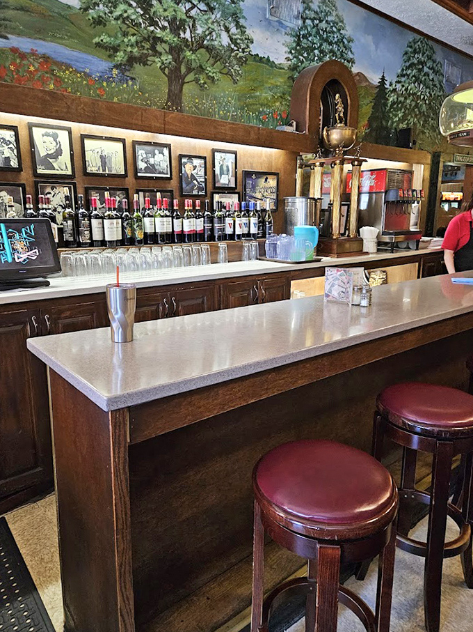 The bar area feels like a living museum where wine bottles and trophies share space with photographs chronicling Akron's history one pizza at a time.