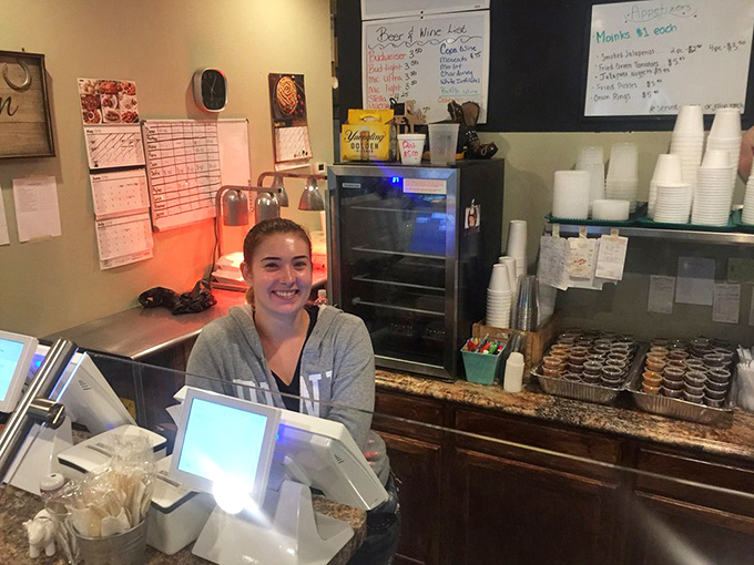 Where barbecue dreams begin! That smile isn't just customer service&mdash;it's the confidence of someone who knows you're about to have a religious experience.