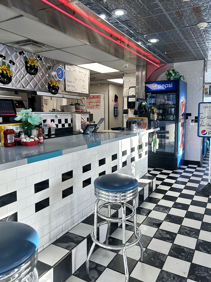 The counter where magic happens&mdash;where solo diners become regulars and regulars become family. Those chrome stools have supported generations of Michigan behinds.