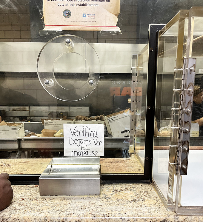 Chicken bathed in sauce, nestled against golden fries—a combination so perfect it should have its own national holiday.