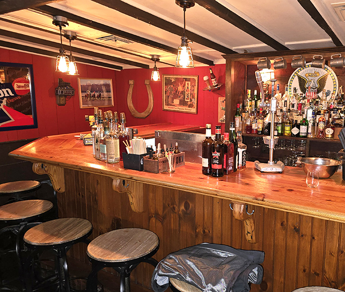The bar's wooden counter and red walls create that perfect neighborhood watering hole vibe &ndash; where everybody might not know your name yet, but they soon will.
