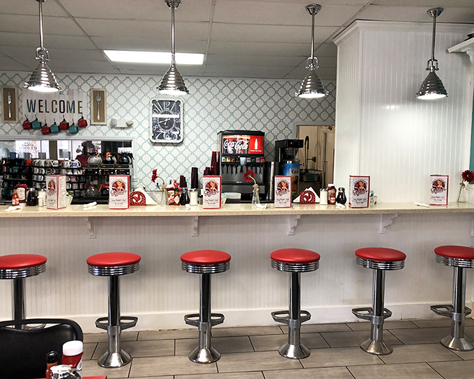 The counter seating offers front-row tickets to the breakfast show, where red vinyl stools have witnessed countless Florida mornings.