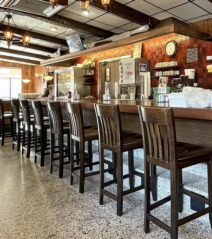 Bar seating: where solo diners become temporary neighbors and the coffee keeps flowing until you say when.