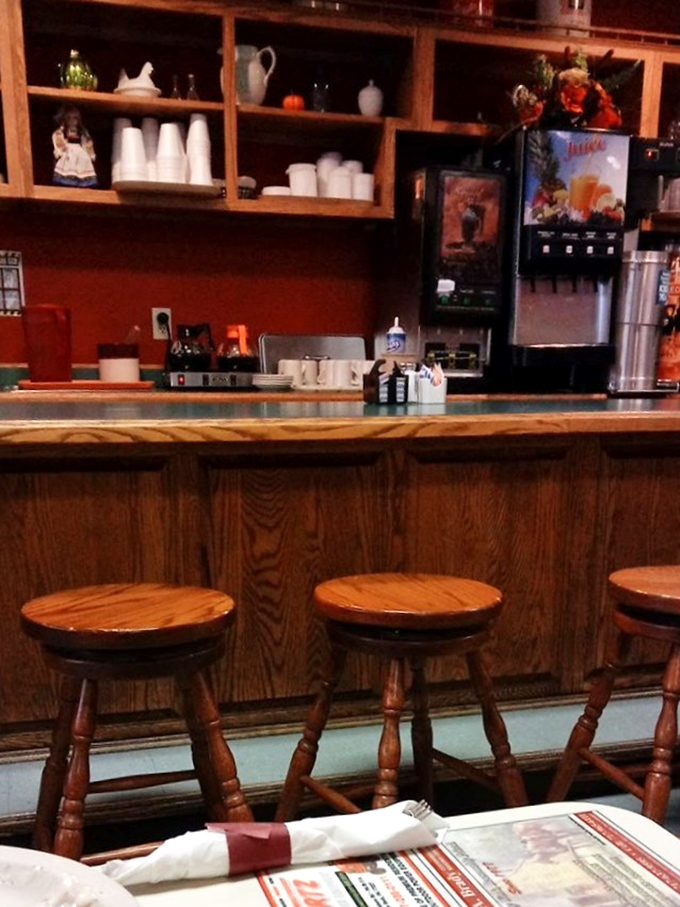 The counter where solo diners find community, where regulars have claimed their territory, and where the coffee is always just a nod away.