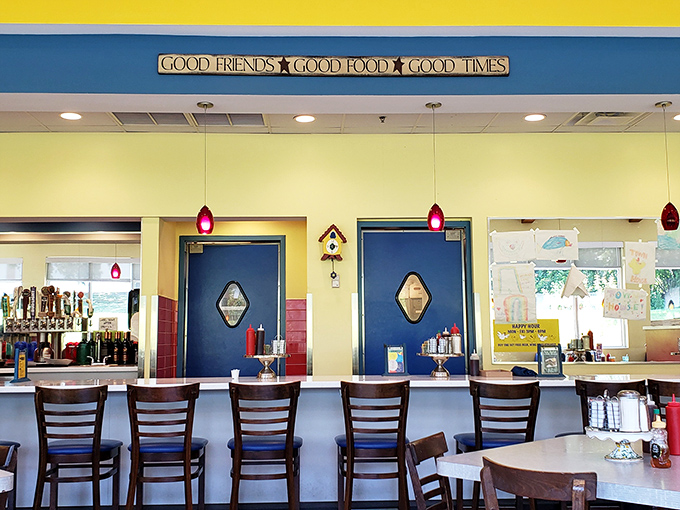The counter seating area where regulars exchange local gossip and newcomers become instant friends. "Good Friends, Good Food, Good Times" indeed!