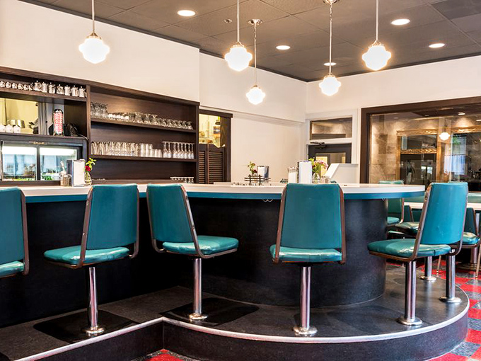 The counter seats &ndash; where solo diners become temporary neighbors and the turquoise vinyl adds a pop of retro charm.