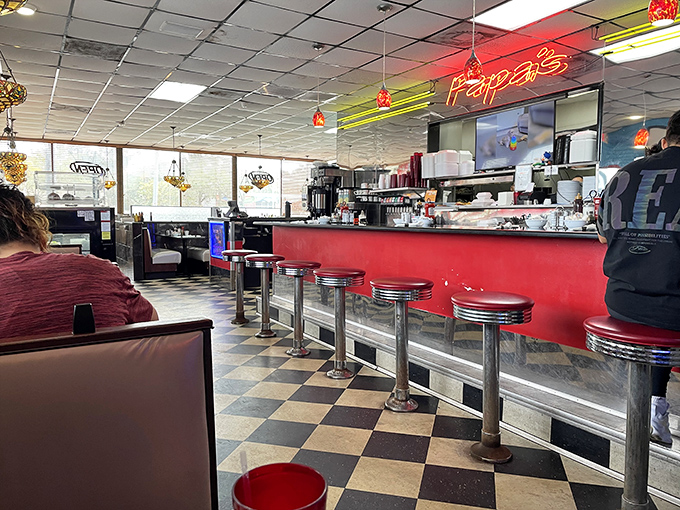 The counter seating &ndash; diner sociology's front row. Where solo diners become temporary neighbors and coffee refills are just a glance away.