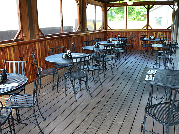 The screened patio offers a serene escape where you can enjoy your overstuffed sandwich while pretending the walk back to your car counts as exercise.