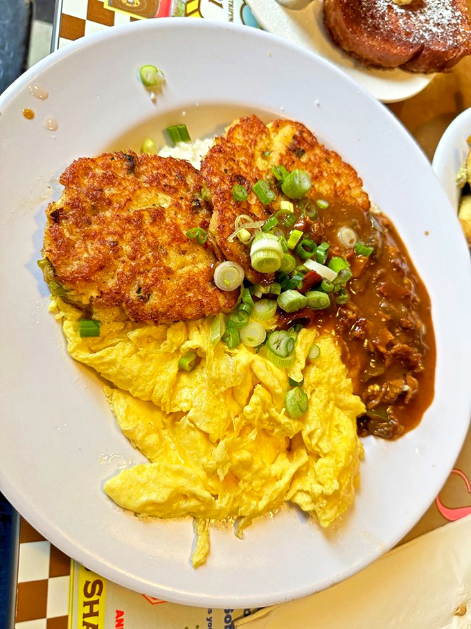Golden crab cakes meet fluffy eggs in a breakfast partnership that would make Neptune himself swim upstream for a taste.
