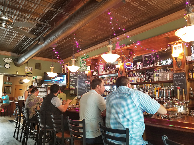 Where locals and visitors alike gather at the bar. That ornate tin ceiling has witnessed countless first dates, celebrations, and "just one more" promises.