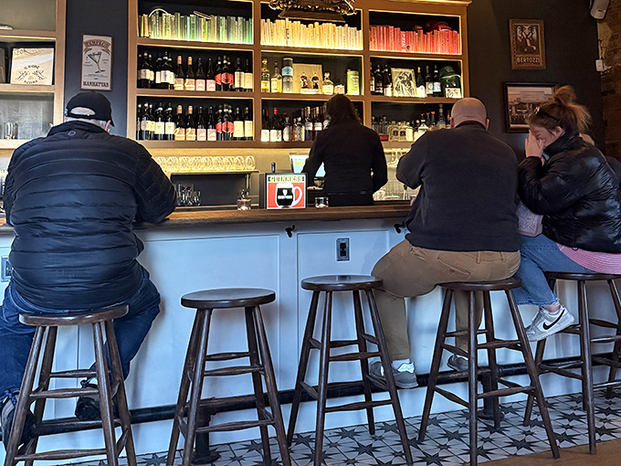 Where pizza pilgrims gather at the altar of good taste. The bar seating offers front-row views of cocktail craftsmanship.