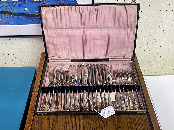 This silver cutlery set awaits its next dinner party&mdash;elegant utensils that elevate meals from mere eating to dining.