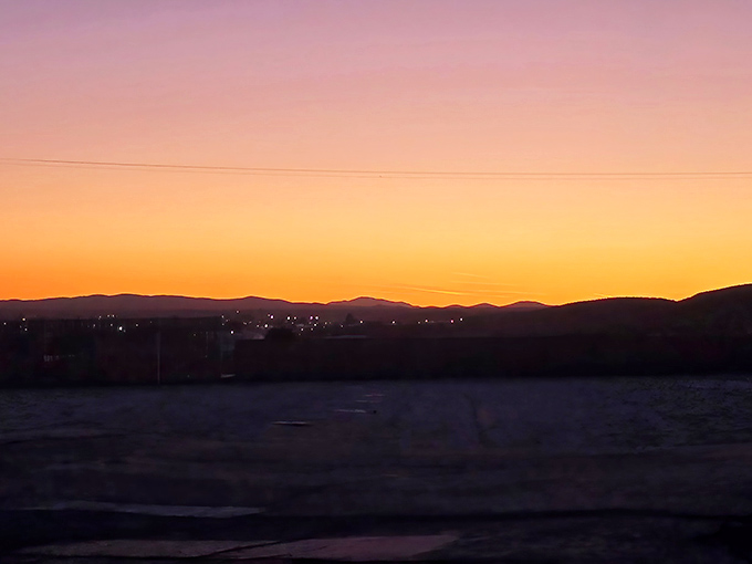 The gradient sky puts on its own show as day surrenders to night, preparing viewers for the feature presentation.