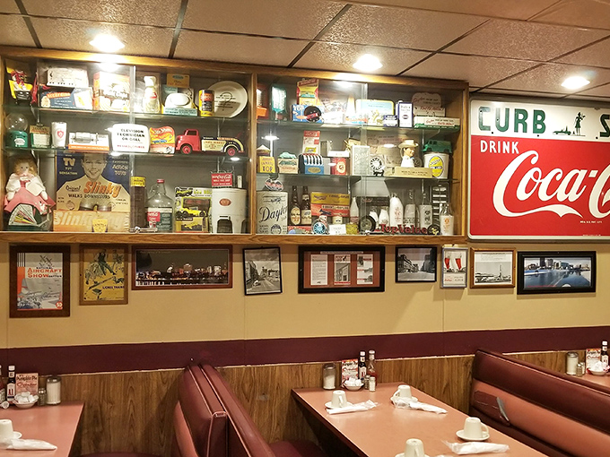 A treasure trove of Americana lines the walls—collectibles that tell stories of roadside attractions, soda fountains, and simpler times.
