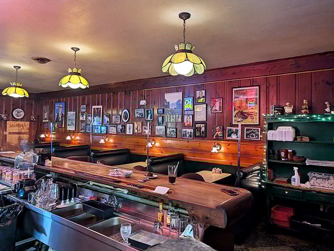 Tiffany-style lamps cast a warm glow over the bar, where wood paneling and memorabilia create the perfect backdrop for pre-dinner cocktails.