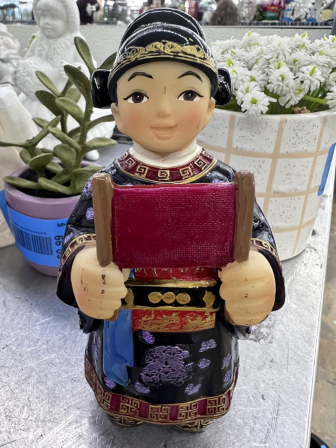 "Hold my scroll," says this cheerful figurine. Asian-inspired decor that adds character without veering into tacky souvenir territory.