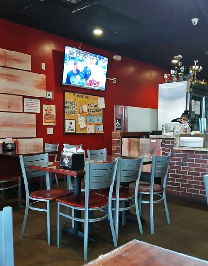 The interior showcases trophies that hint at competition victories. In the barbecue world, hardware on the wall often translates to excellence on the plate.