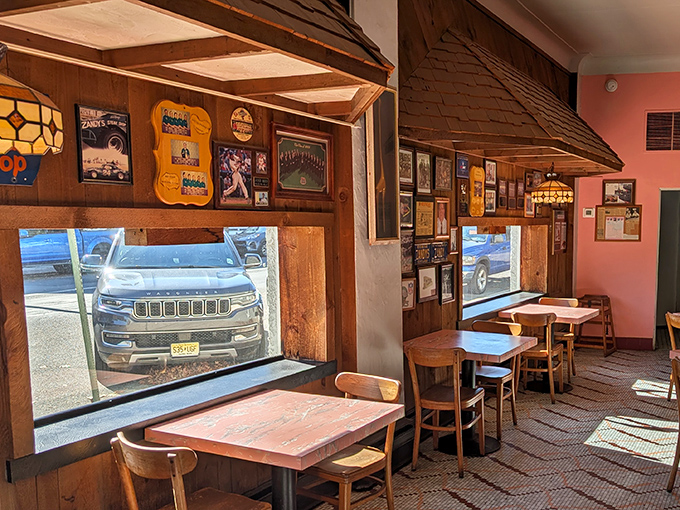 Memorabilia adorns wooden wall panels beneath pitched awnings, each frame and photo a chapter in Zandy's ongoing story of Allentown food history.