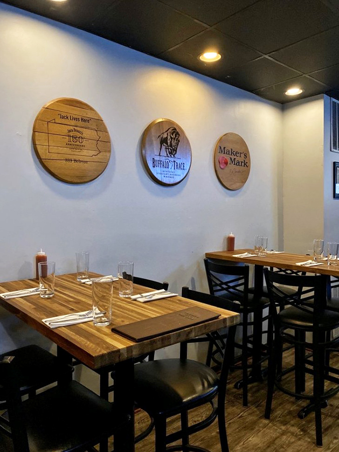 Whiskey barrel lids transformed into wall art—because when the bourbon is gone, the memories (and décor) should remain.