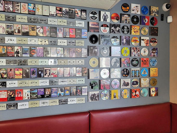 Album covers and vinyl records create a museum-like backdrop that has sparked more musical debates than a radio DJ's autobiography.