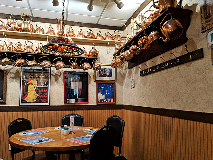 Copper pots and vintage posters create a cozy nook that feels like dining in your Italian grandmother's kitchen&mdash;even if you're Swedish.