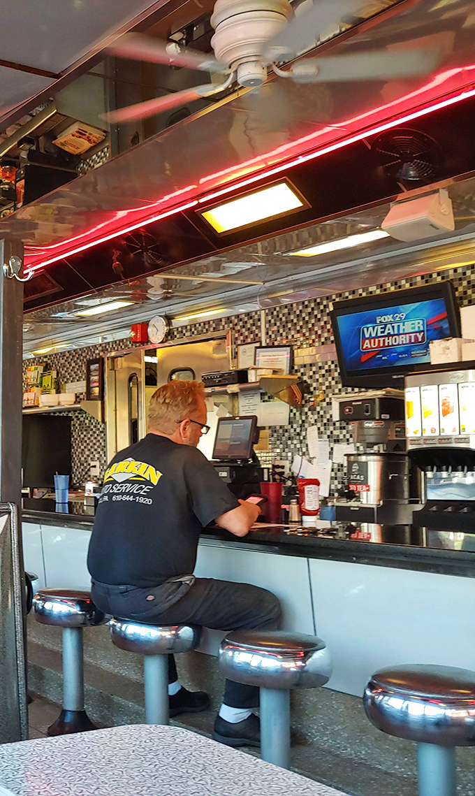 Red neon against the ceiling creates that distinctive diner glow&mdash;the lighting equivalent of comfort food for your eyes.