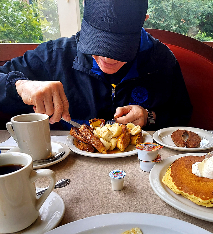 A diner breakfast spread that says "your diet starts tomorrow." The perfect symphony of pancakes, French toast, and coffee that makes morning people out of night owls.