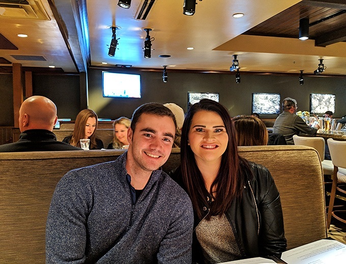 Happy diners enjoying that magical moment when good food, good company, and good lighting all come together for a perfect evening out. 