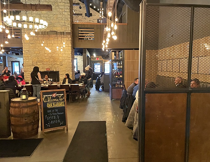 The dining room whispers "stay awhile" with warm wood tones and industrial touches that somehow make exposed beams feel like a hug.