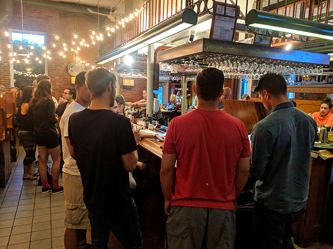 Where strangers become friends over shared plates and craft beers. The string lights aren't just decoration&mdash;they're conversation starters.