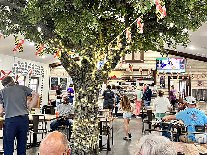 The bustling dining room centered around that magnificent tree creates a community vibe that's as nourishing as the food itself.