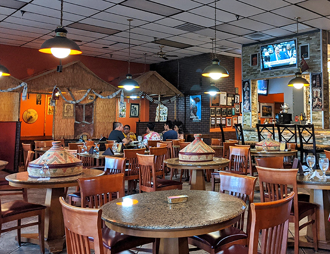 Traditional mesobs (woven tables) dot the dining room, inviting shared meals and conversation. Each basket-like table tells stories of communal dining traditions centuries old.