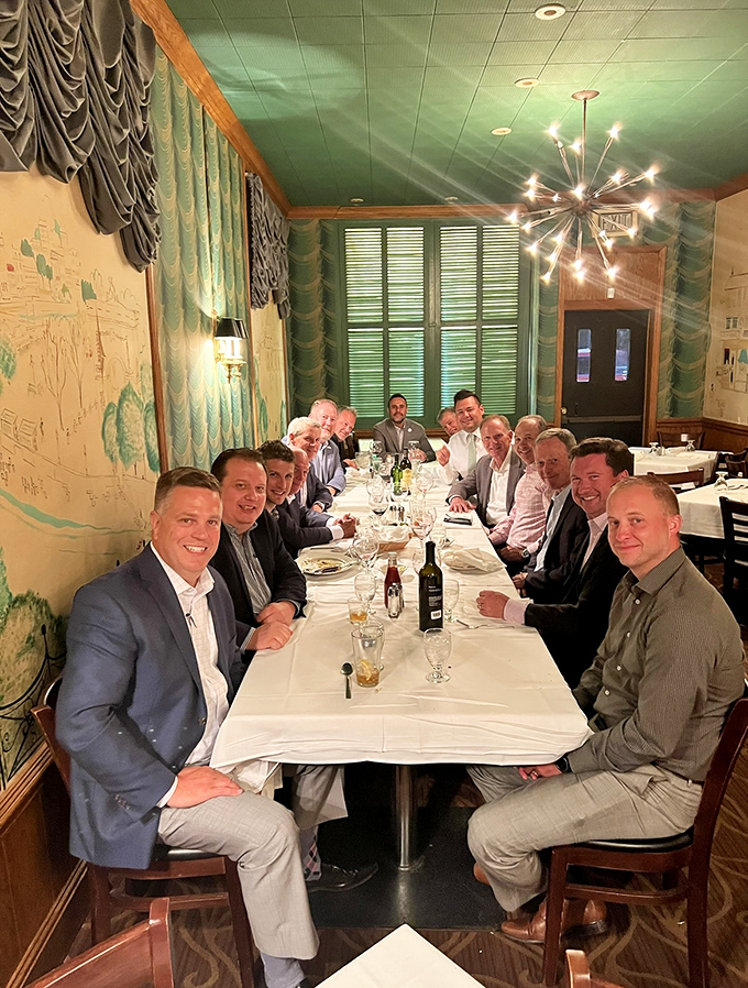 A gathering of the "Clean Plate Club." Nothing brings people together like perfectly cooked steaks and the shared understanding that diet starts tomorrow.